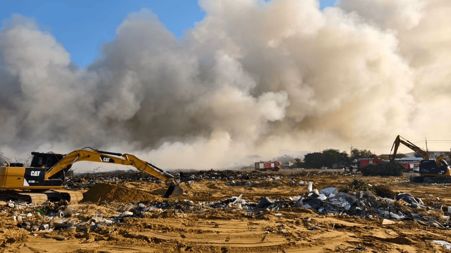 Firefighters battling fires at illegal landfill in Samut Prakan