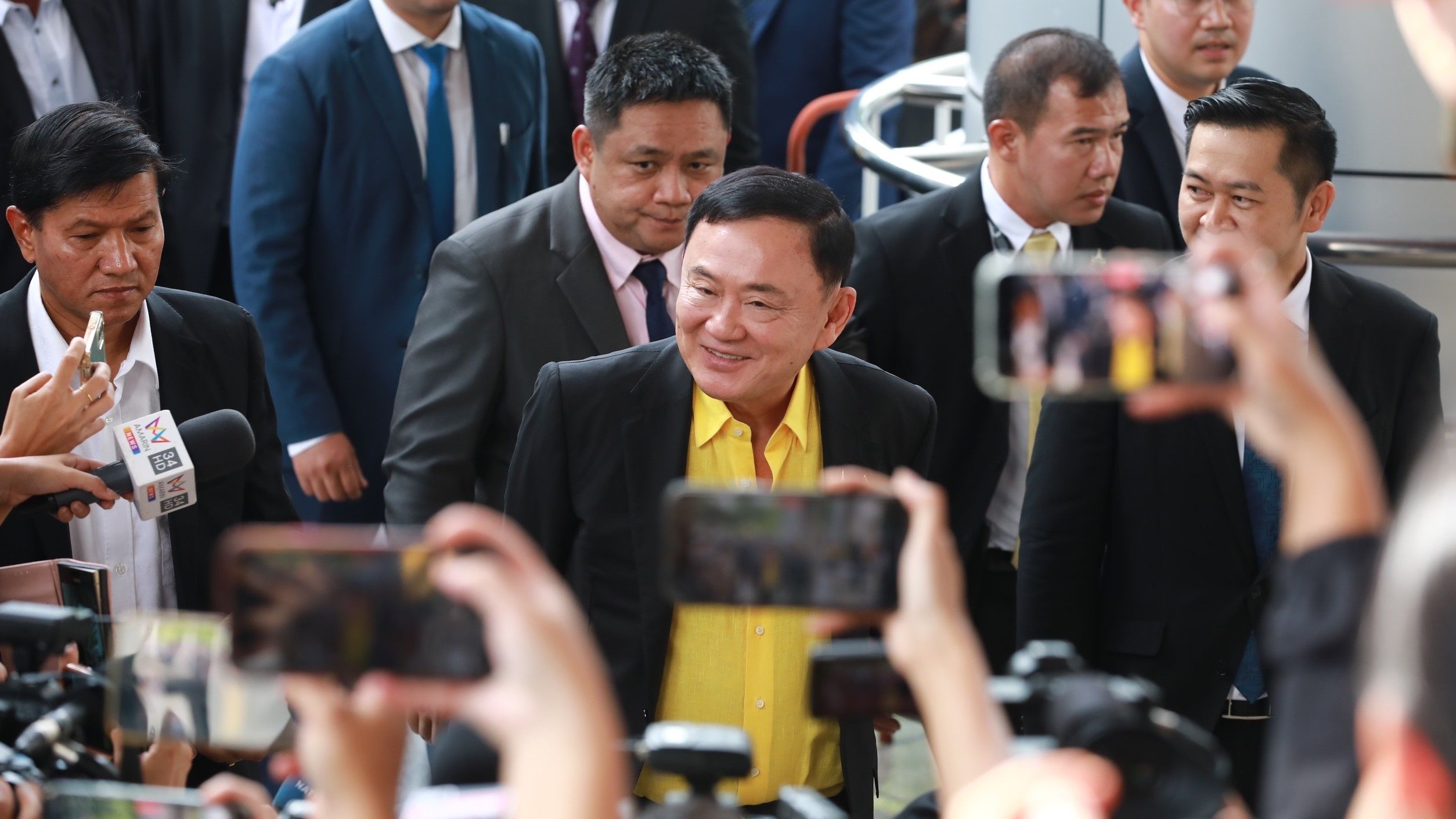 Thaksin attends pre-trial hearing in lèse majesté case