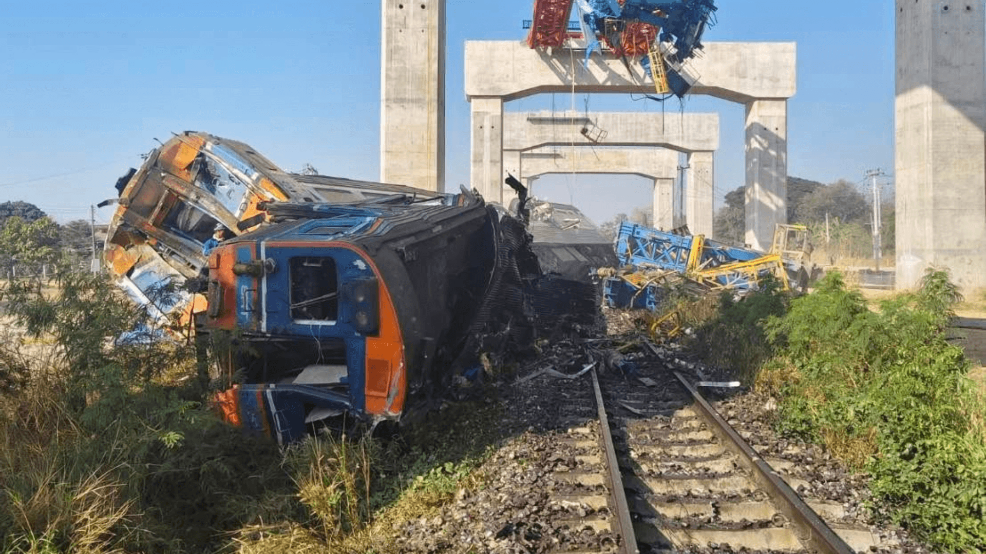 At least 22 dead as construction crane crashes onto passenger train in Korat